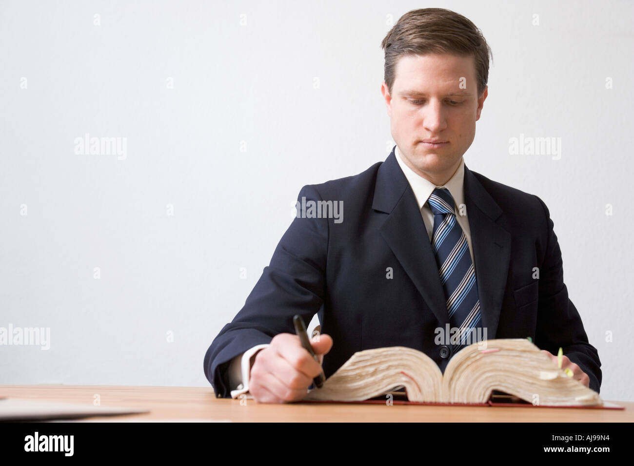 Consulting a book hi-res stock photography and images - Alamy