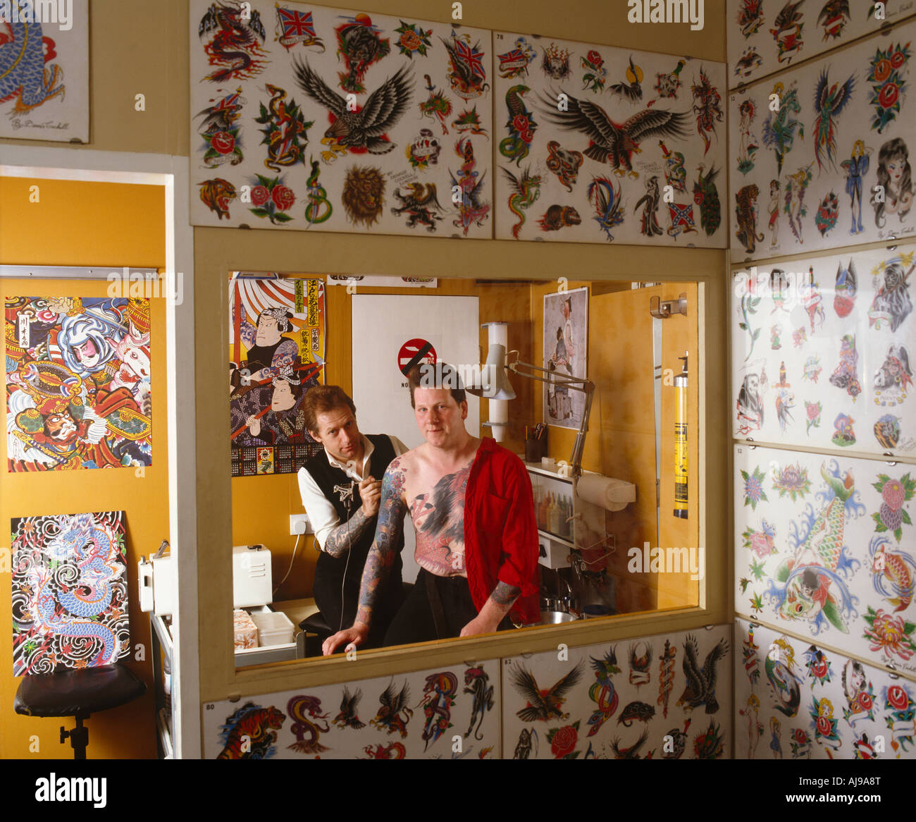 Tattooist and Client Stock Photo - Alamy
