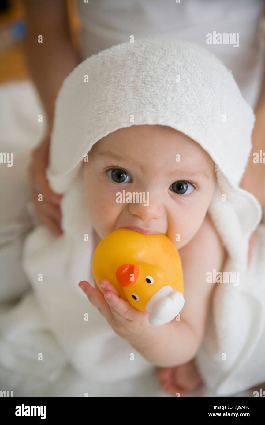 Mother drying baby with a towel Stock Photo - Alamy