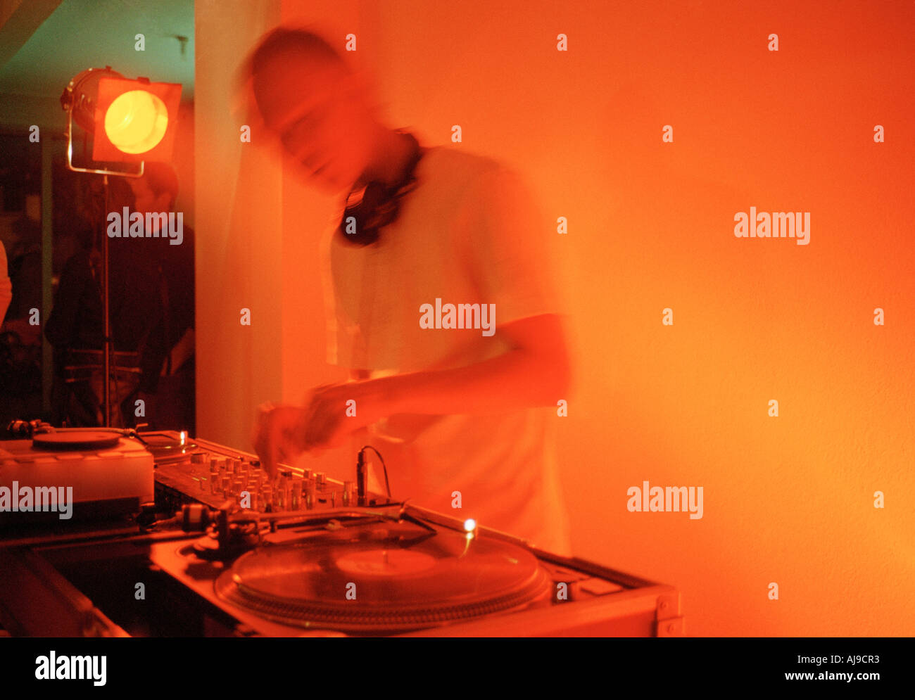 DJ playing records at nightclub Stock Photo - Alamy