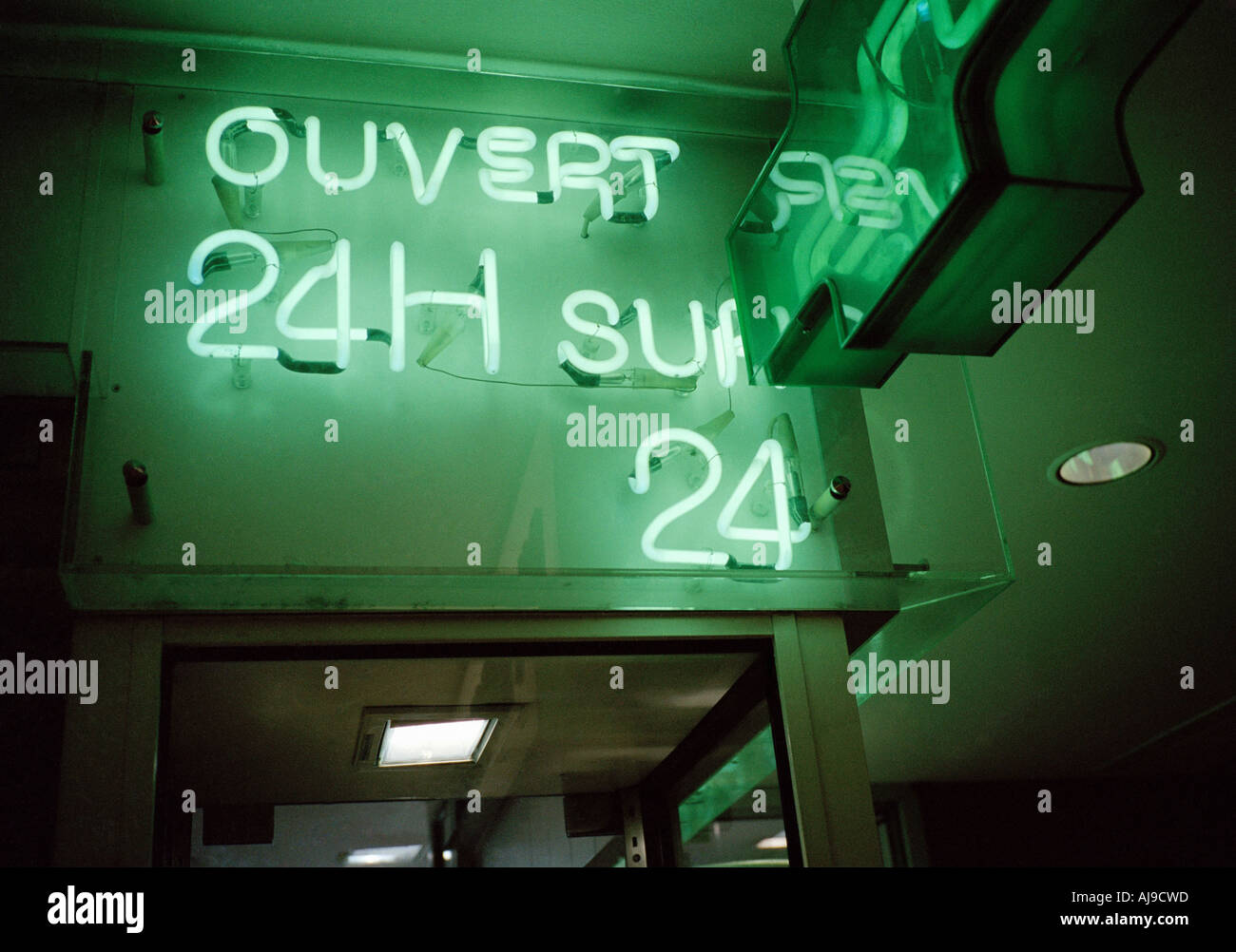 Open 24 hours neon sign Stock Photo - Alamy