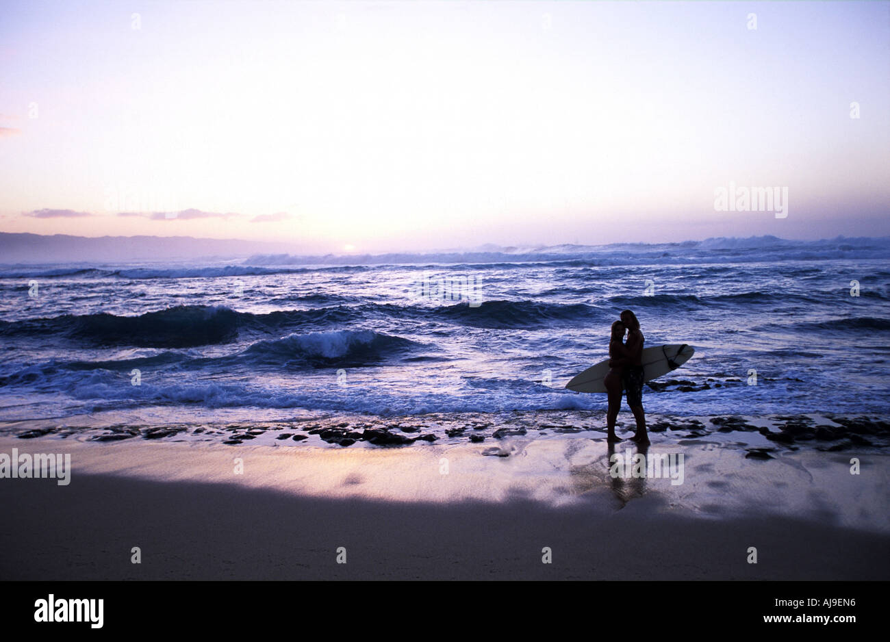 Hawaii oahu woman standing on beach surf board hi-res stock photography ...