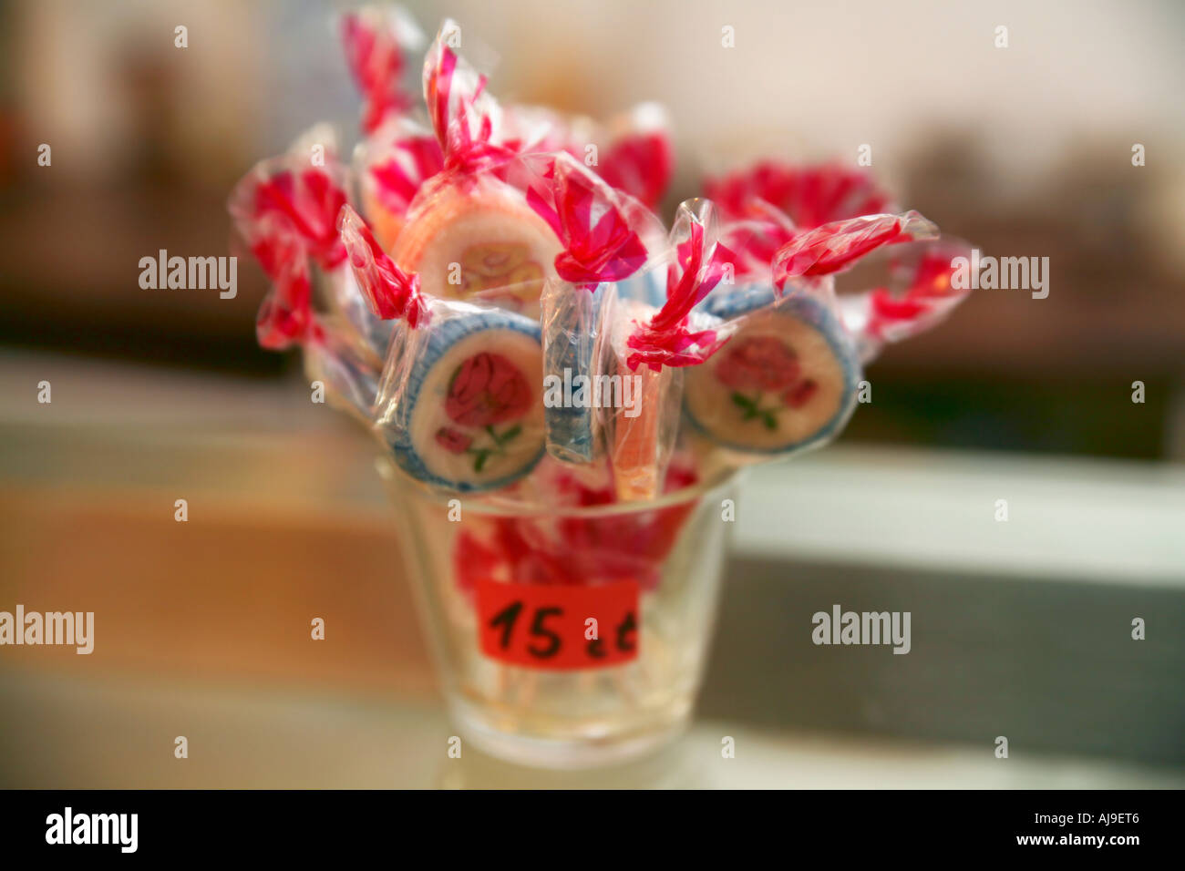 Lollipops in container on cafe counter Stock Photo - Alamy