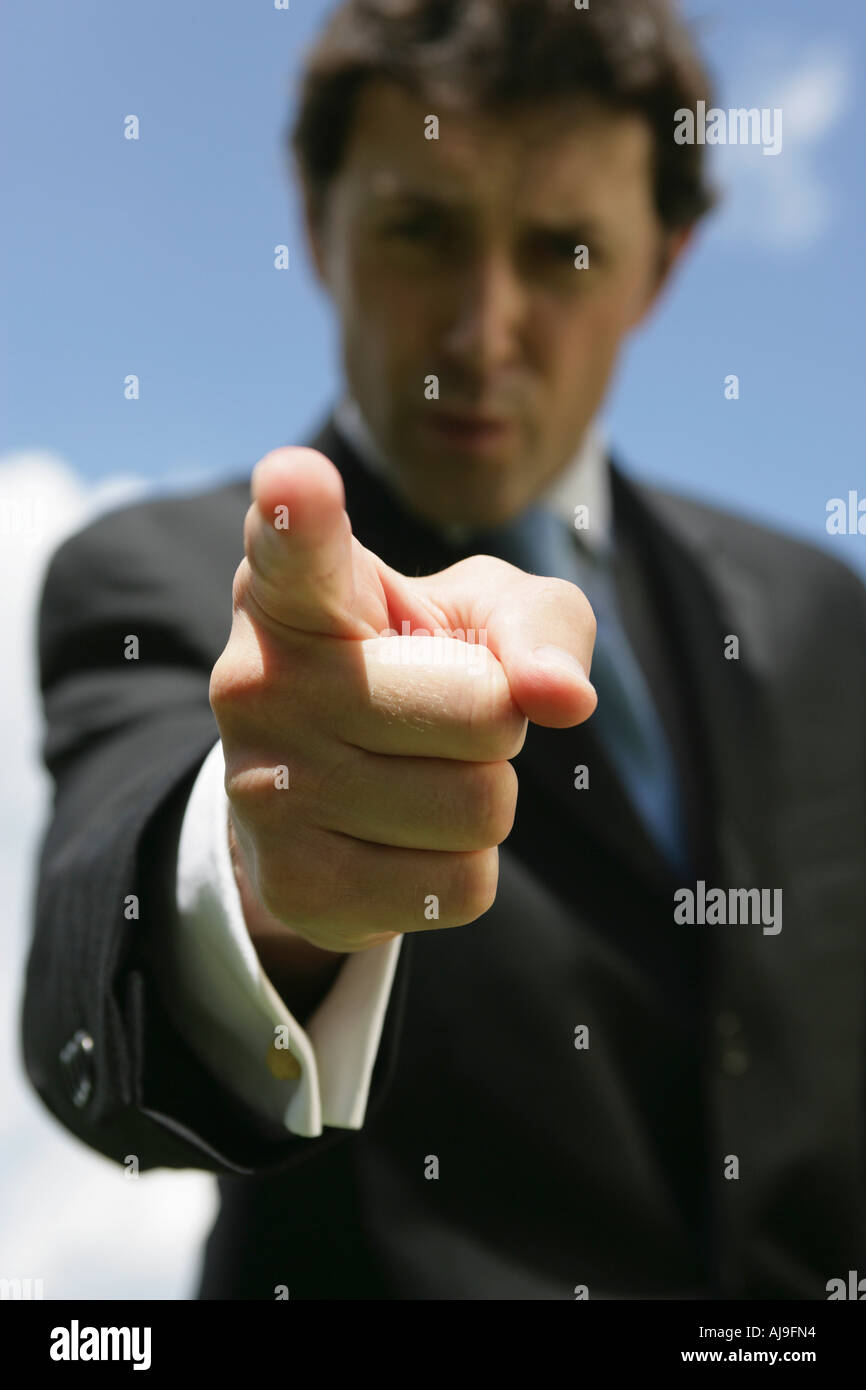 A businessman pointing sternly Stock Photo - Alamy