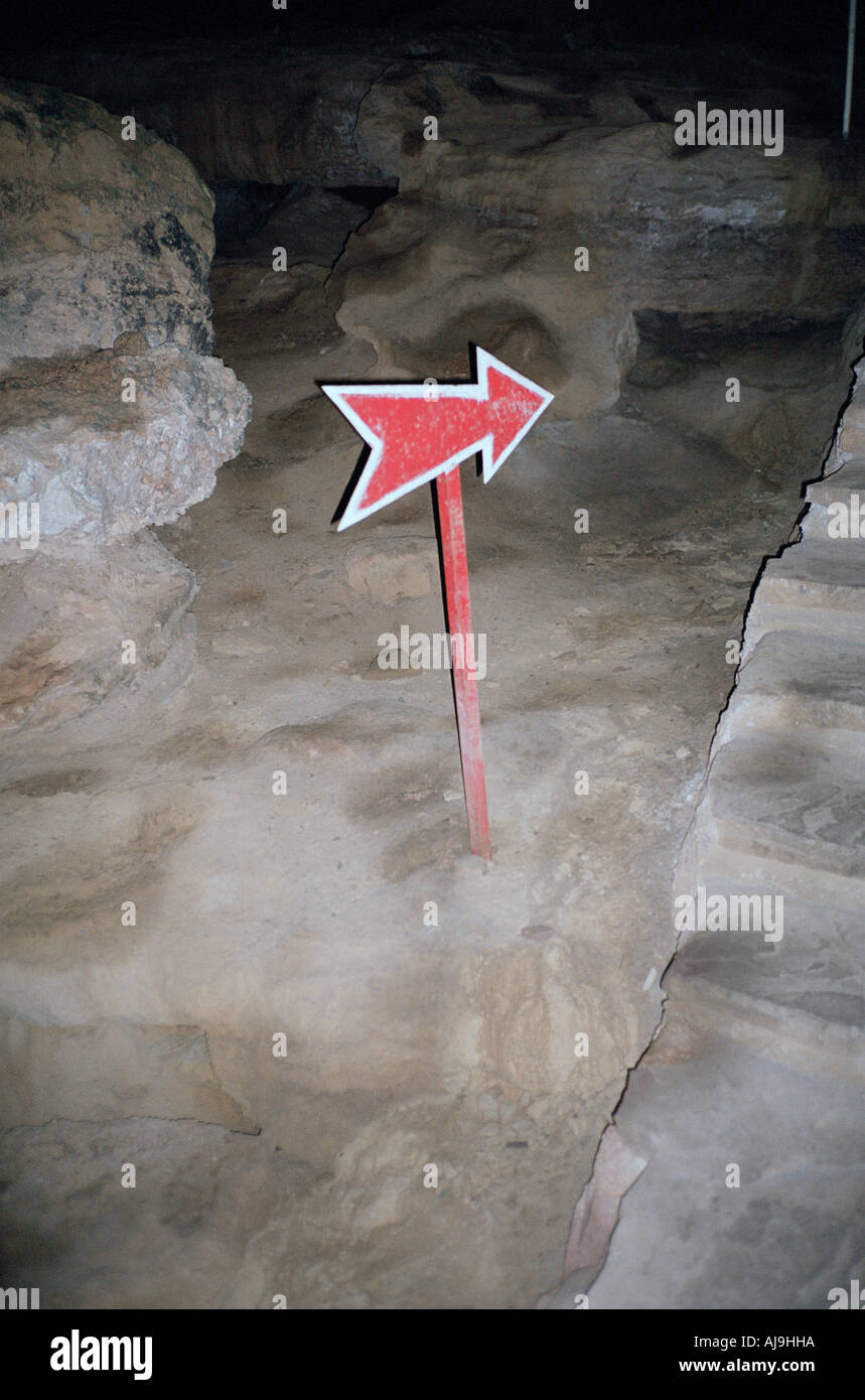 Arrow sign in cave Stock Photo - Alamy
