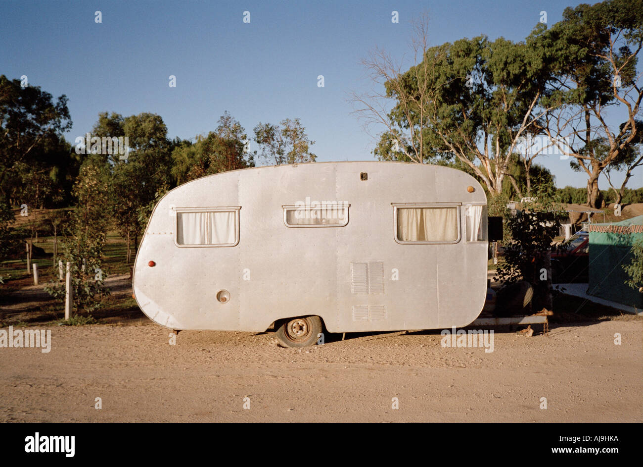 Trailer parked in camping ground Stock Photo - Alamy