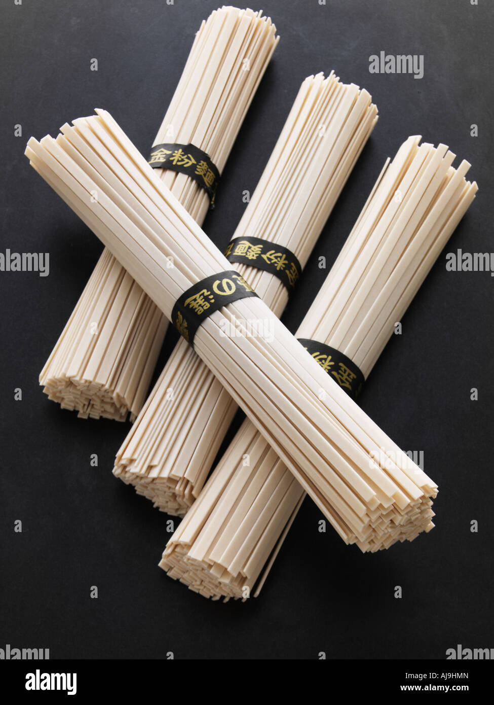 Bundles of Japanese rice noodles on a dark background Stock Photo - Alamy