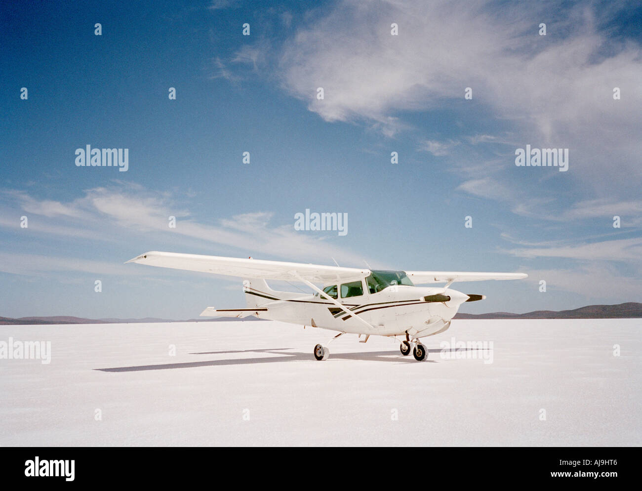 Propeller airplane on salt flat Stock Photo - Alamy