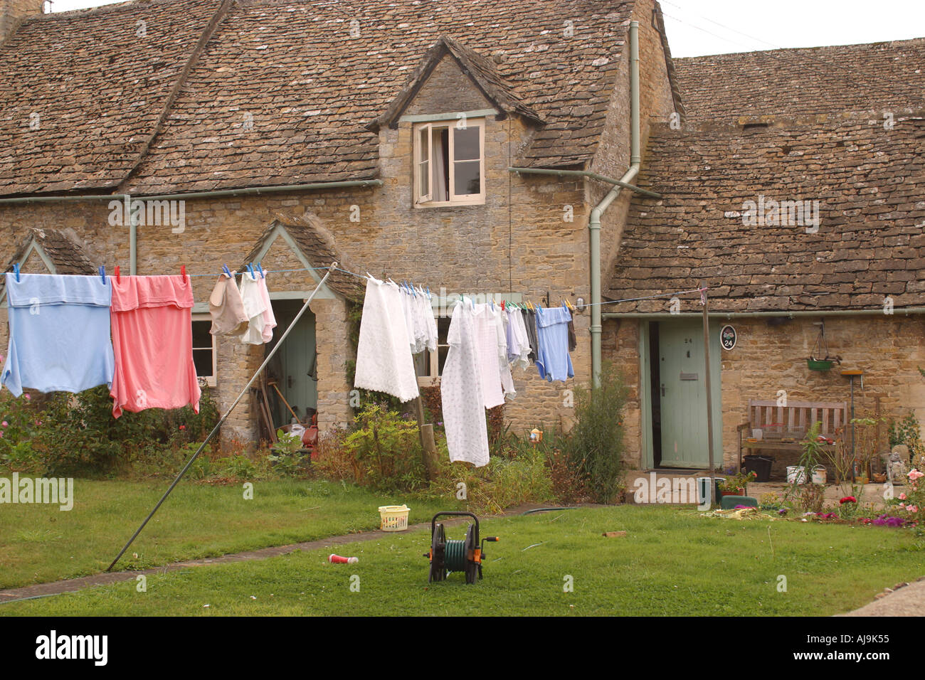 Clothes on the washing line in a cottage garden Stock Photo - Alamy
