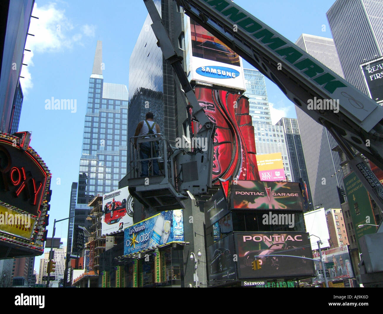 repairing a neon sign in times square New York Stock Photo - Alamy