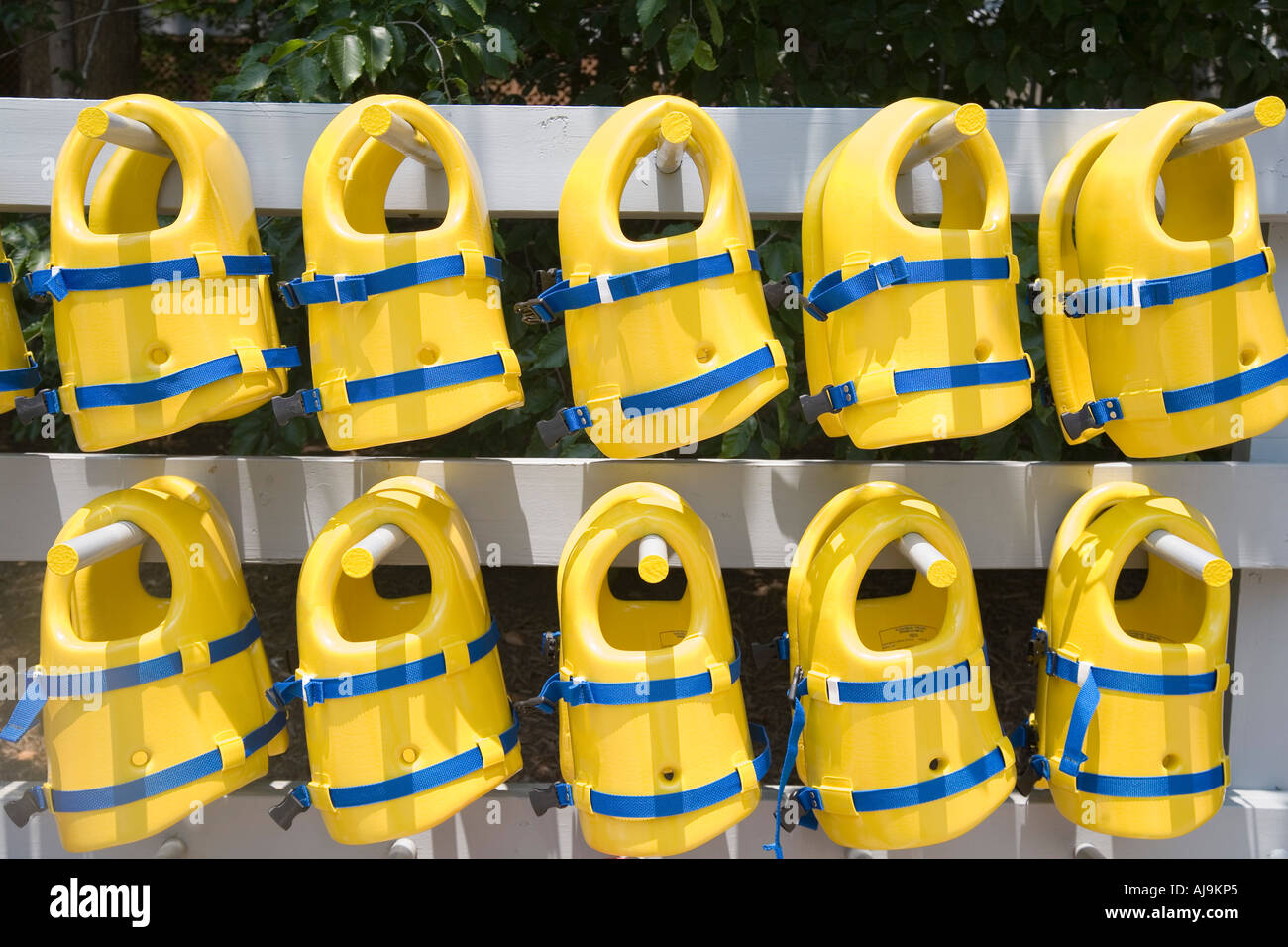 Life jackets arranged on rack Stock Photo - Alamy