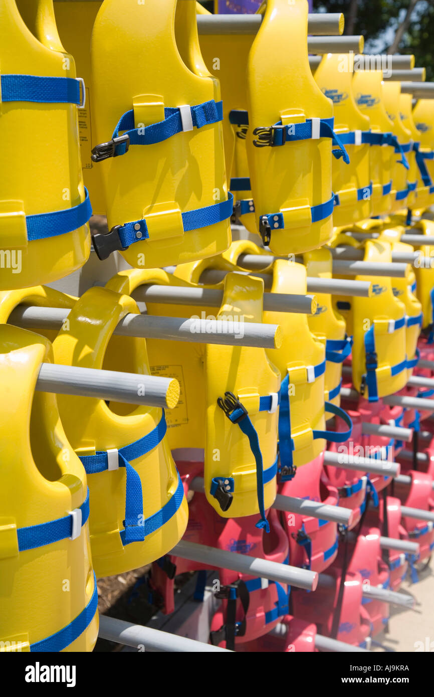 Life jackets arranged on rack Stock Photo - Alamy