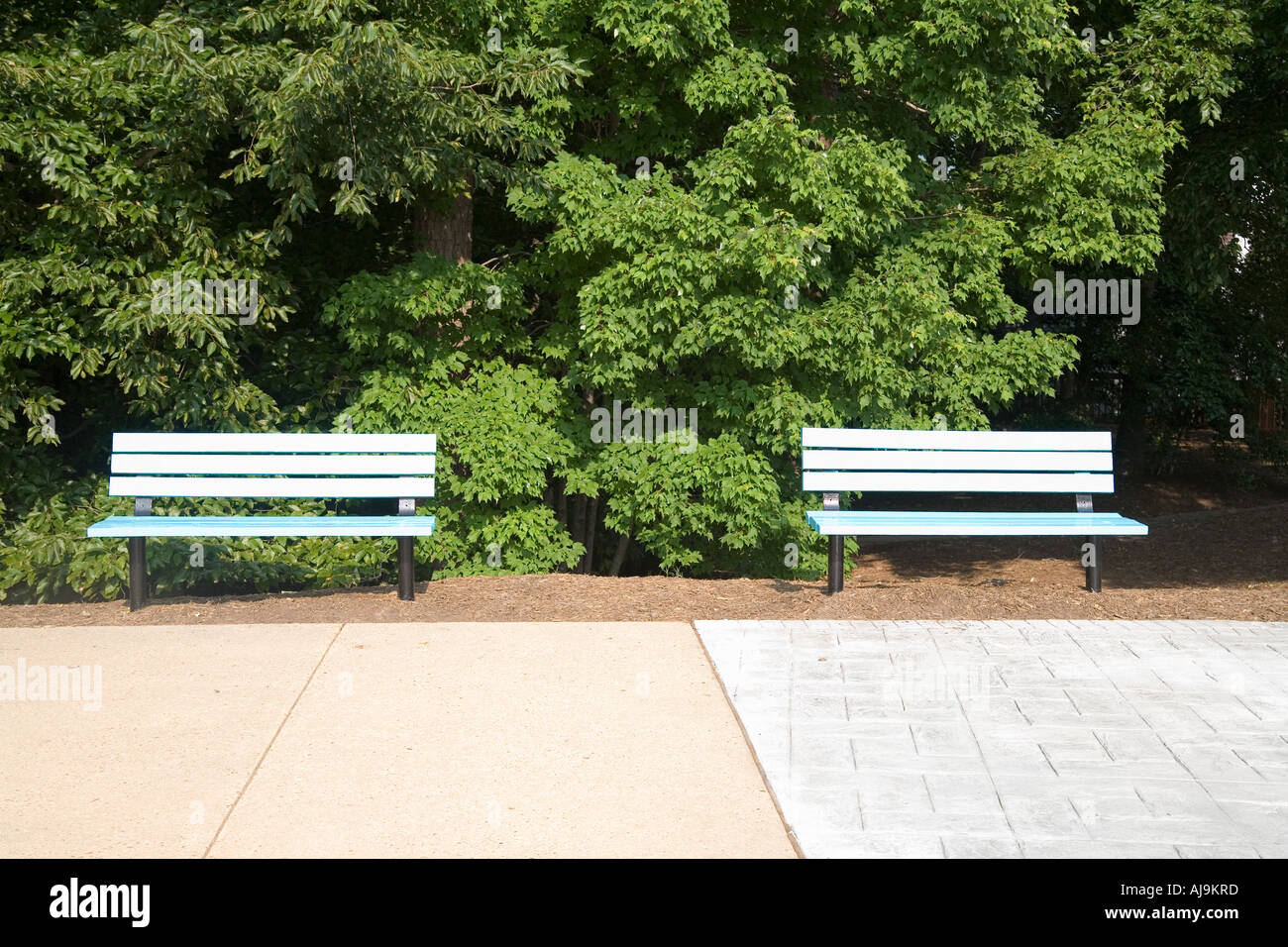 Park benches side by side Stock Photo - Alamy
