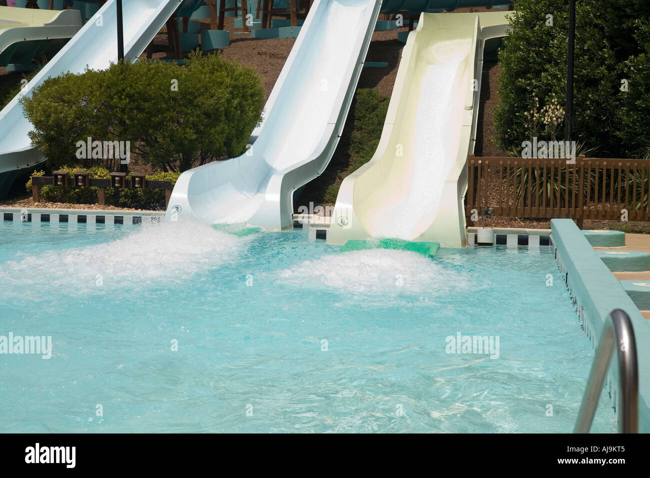 Swimming pool at the bottom of water slide Stock Photo - Alamy