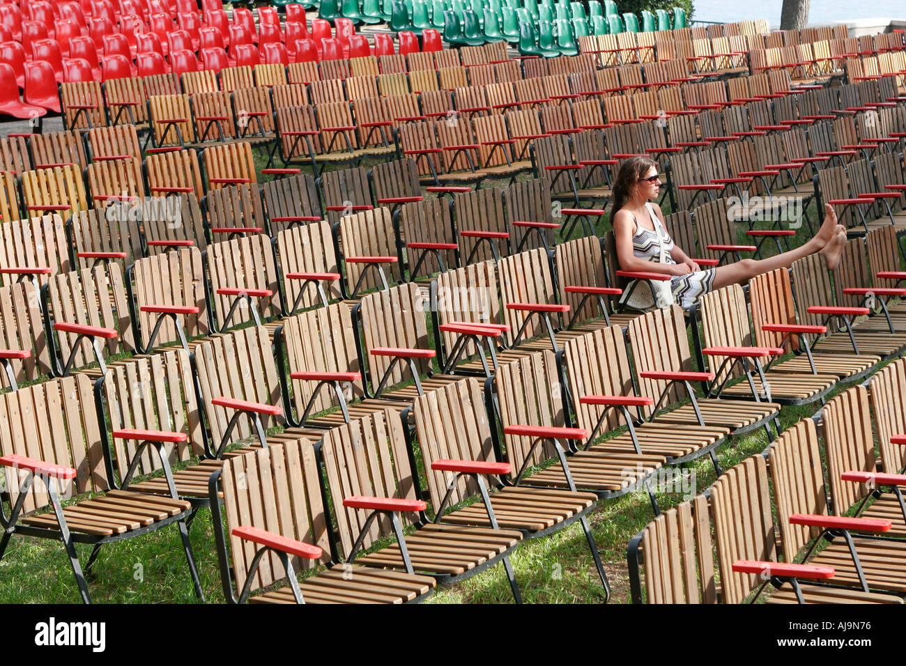 Single person sitting Stock Photo - Alamy