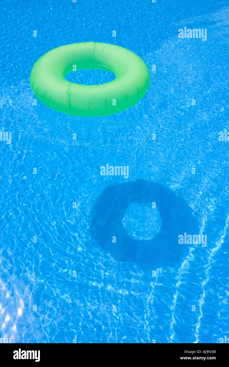 An inflatable ring floating in a swimming pool Stock Photo - Alamy