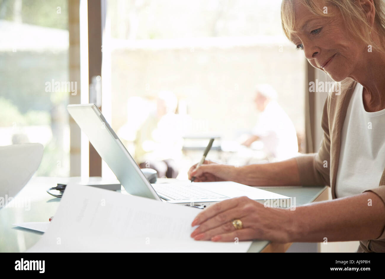 60 year old woman working hi-res stock photography and images - Alamy