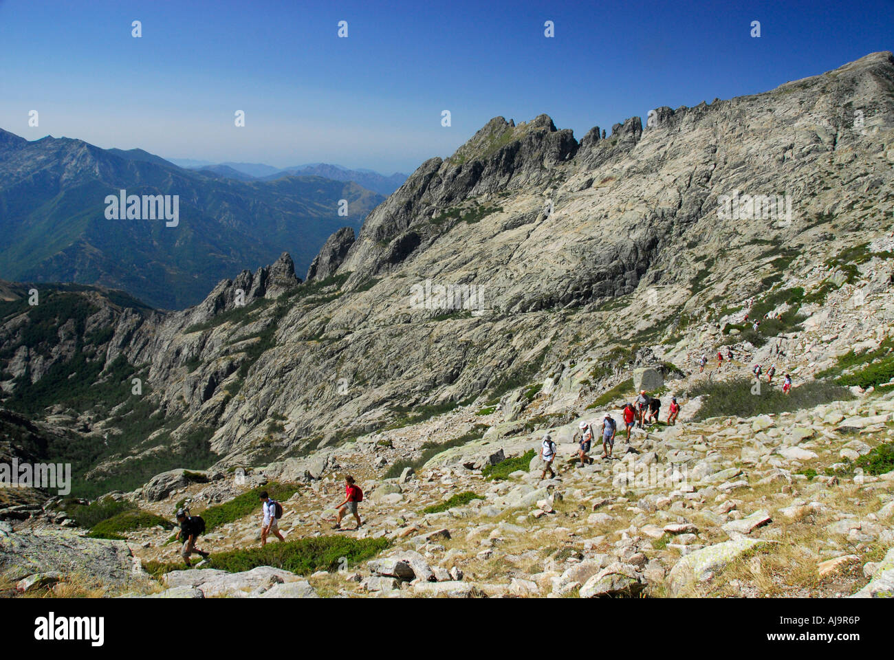 Hikers ascending Monte d'Oro, Corsica Stock Photo - Alamy