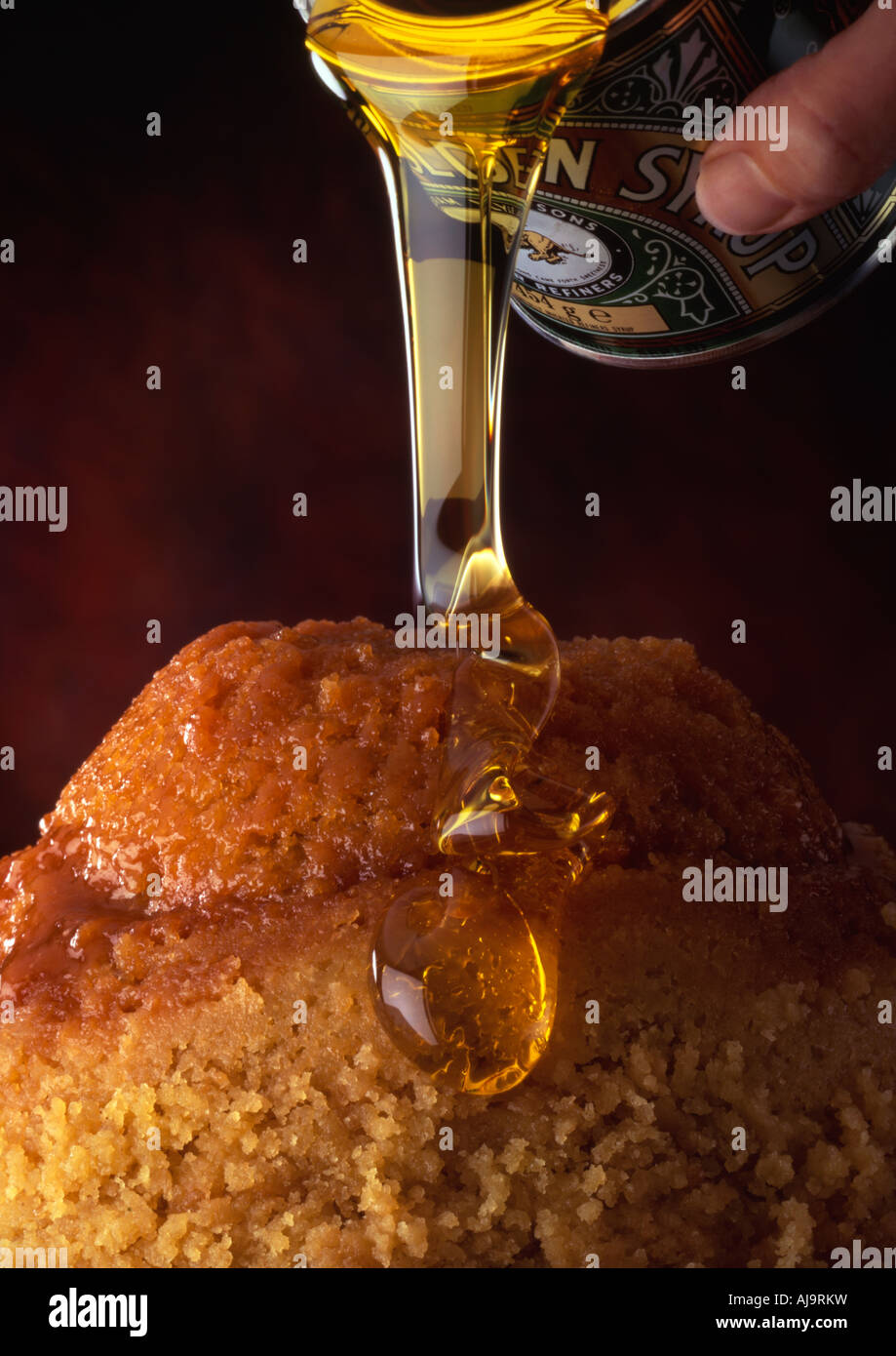 Golden syrup pouring onto a steamed pudding Stock Photo - Alamy