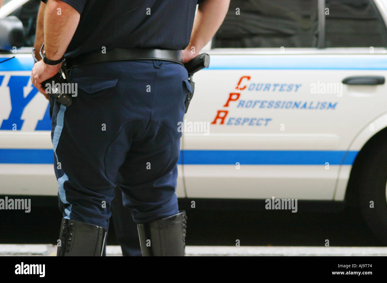 NYPD police in uniform in front of patrol car NYC Courtesy ...