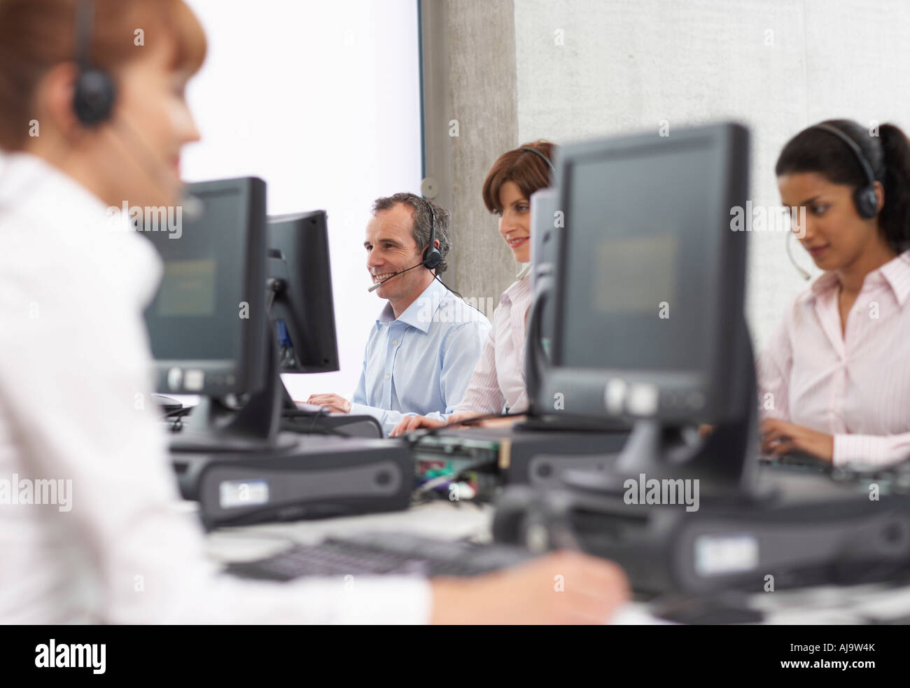 Focus computer headphones work group hi-res stock photography and ...