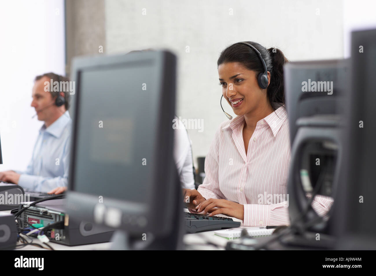 Focus computer headphones work group hi-res stock photography and ...