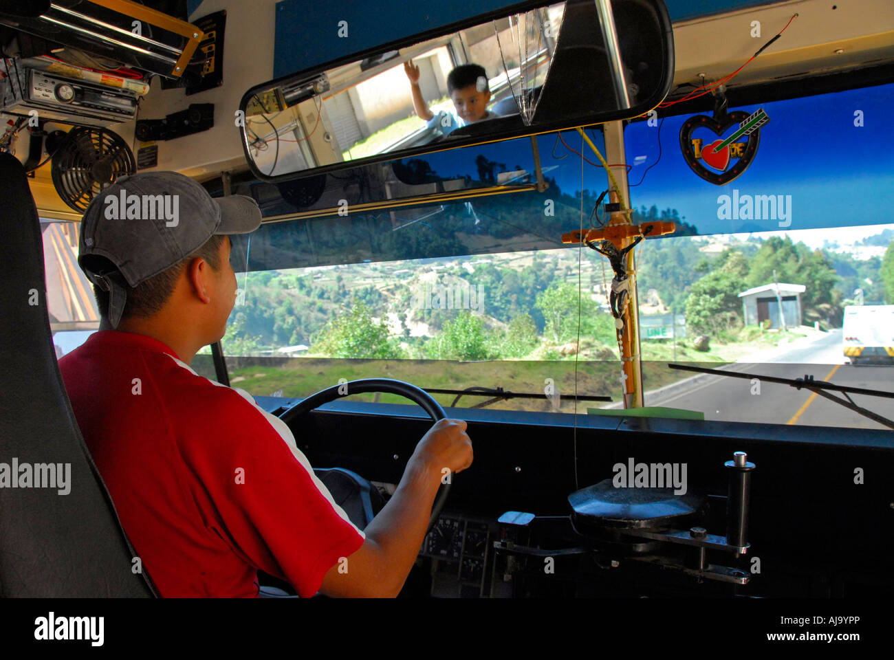 Chicken bus interior with driver, Guatemala Stock Photo - Alamy