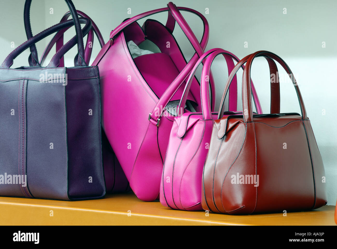 Leather handbags on display in a shop in Milan Stock Photo - Alamy