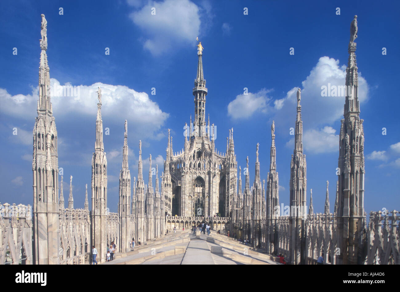on th top of th Cathedral with sculptures on gothic pillars Milan ...