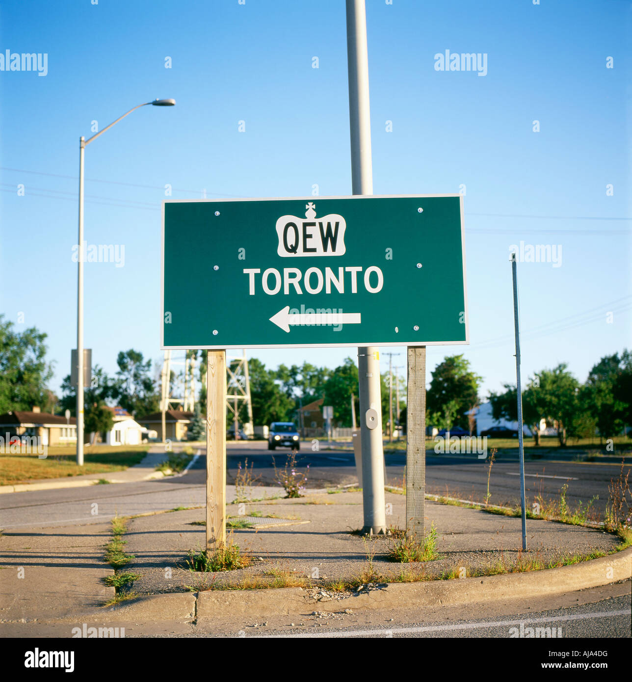 A Queen Elizabeth Highway QEW sign pointing the direction to Ontario ...
