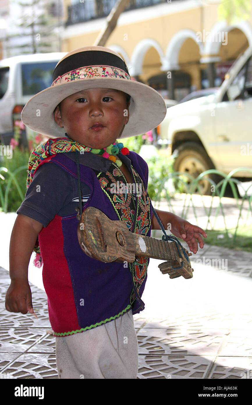 A traditional Bolivian child with hat and Charango, Children ...