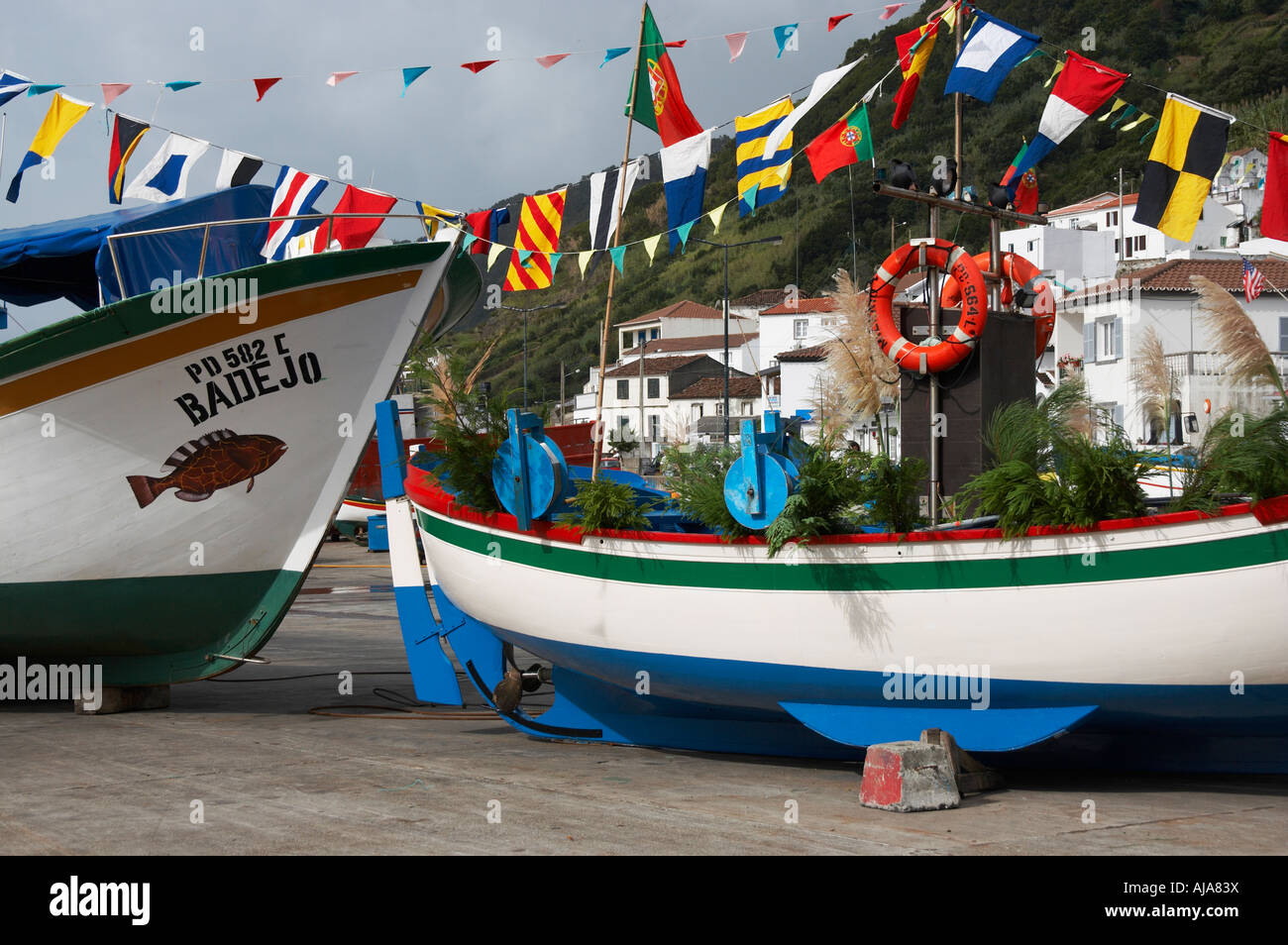 Fishing boats decorated with flags in preparation for local fiesta ...