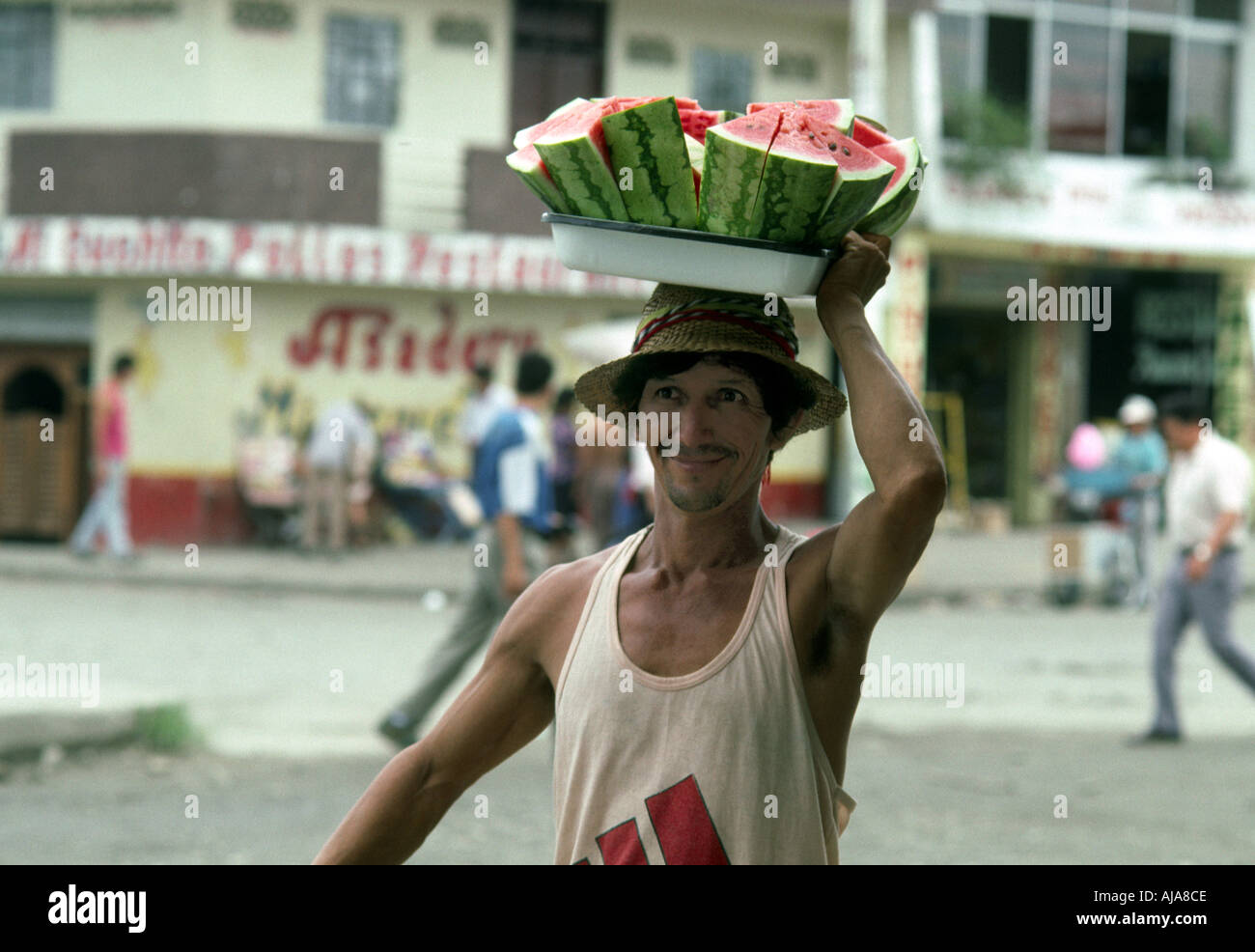 Ecuador Lago Agrio, new Loja, street seller of melon slices in this oil ...