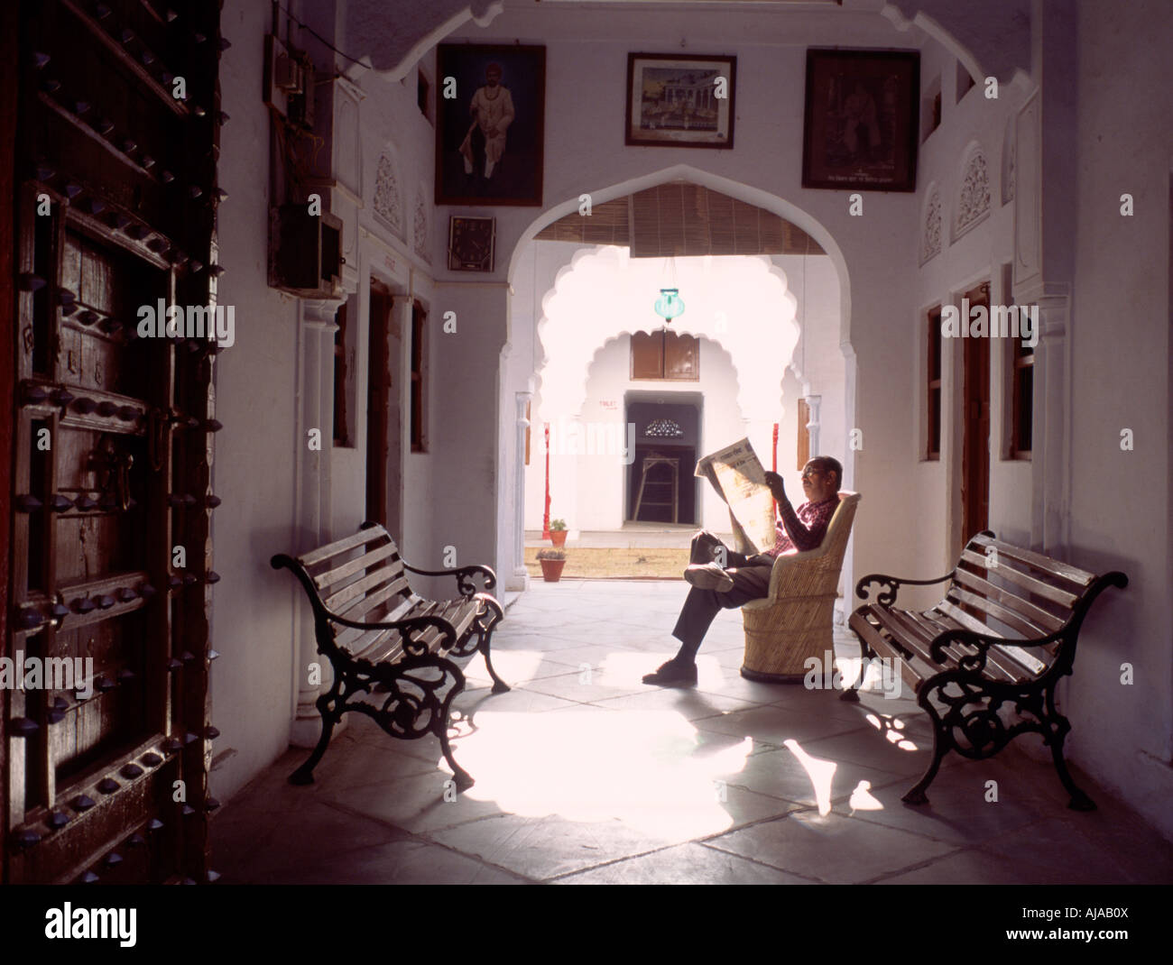 Indian man reading paper at home, Delhi, India Stock Photo - Alamy