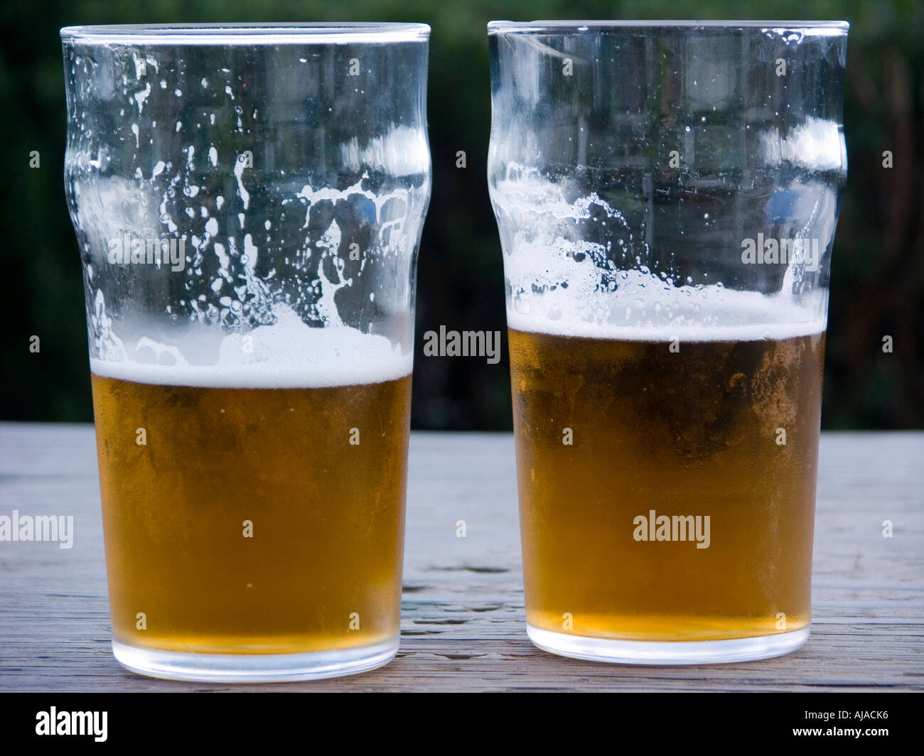 Empty half empty beer glasses hi-res stock photography and images - Alamy
