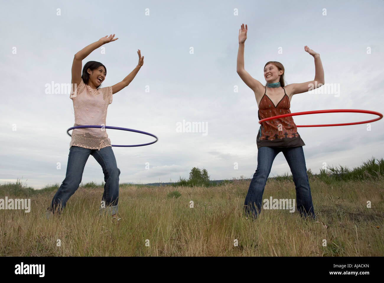 Friends Playing with Hula-Hoops Stock Photo - Alamy