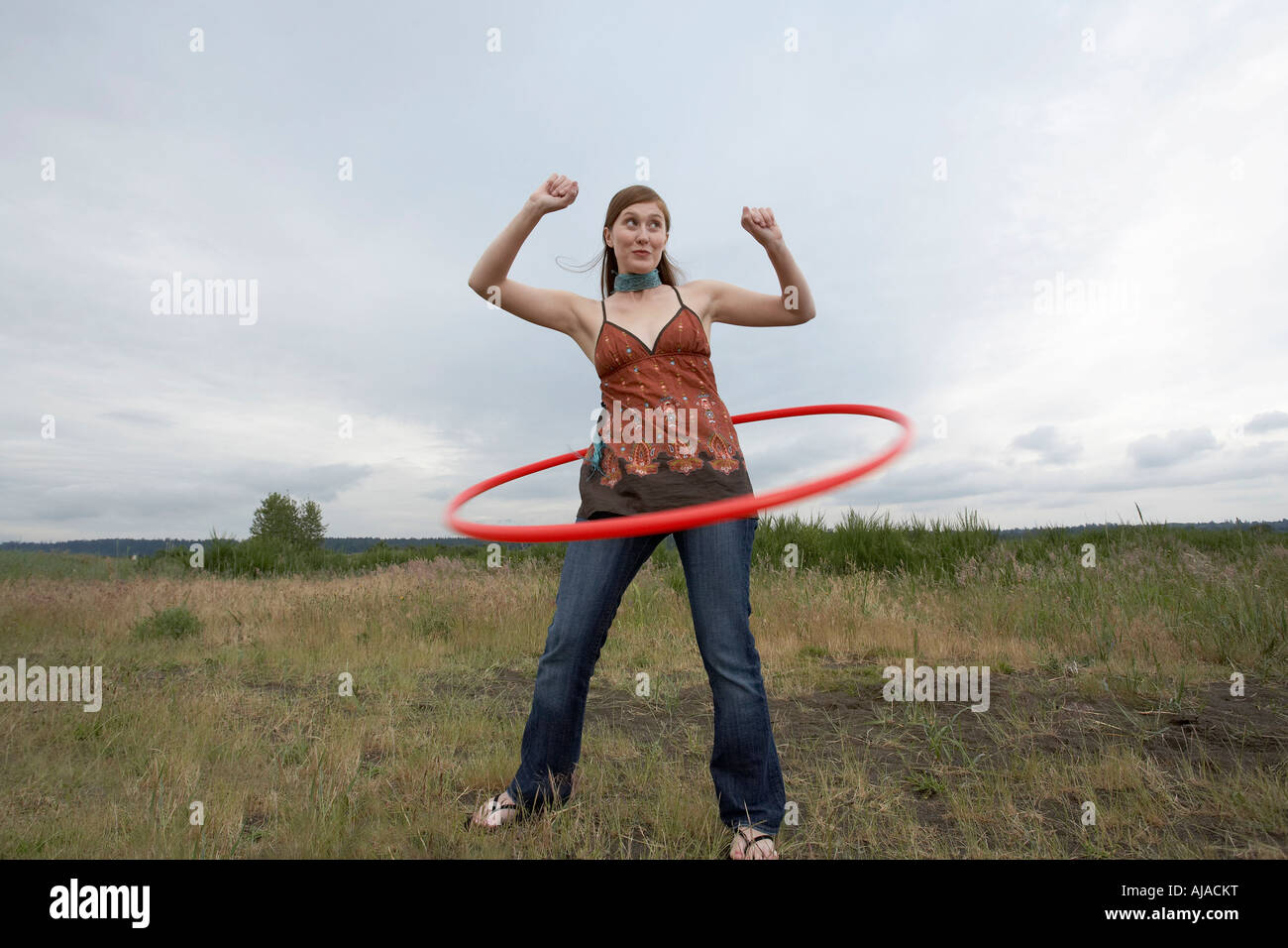 Woman Playing with Hula-Hoop Stock Photo - Alamy