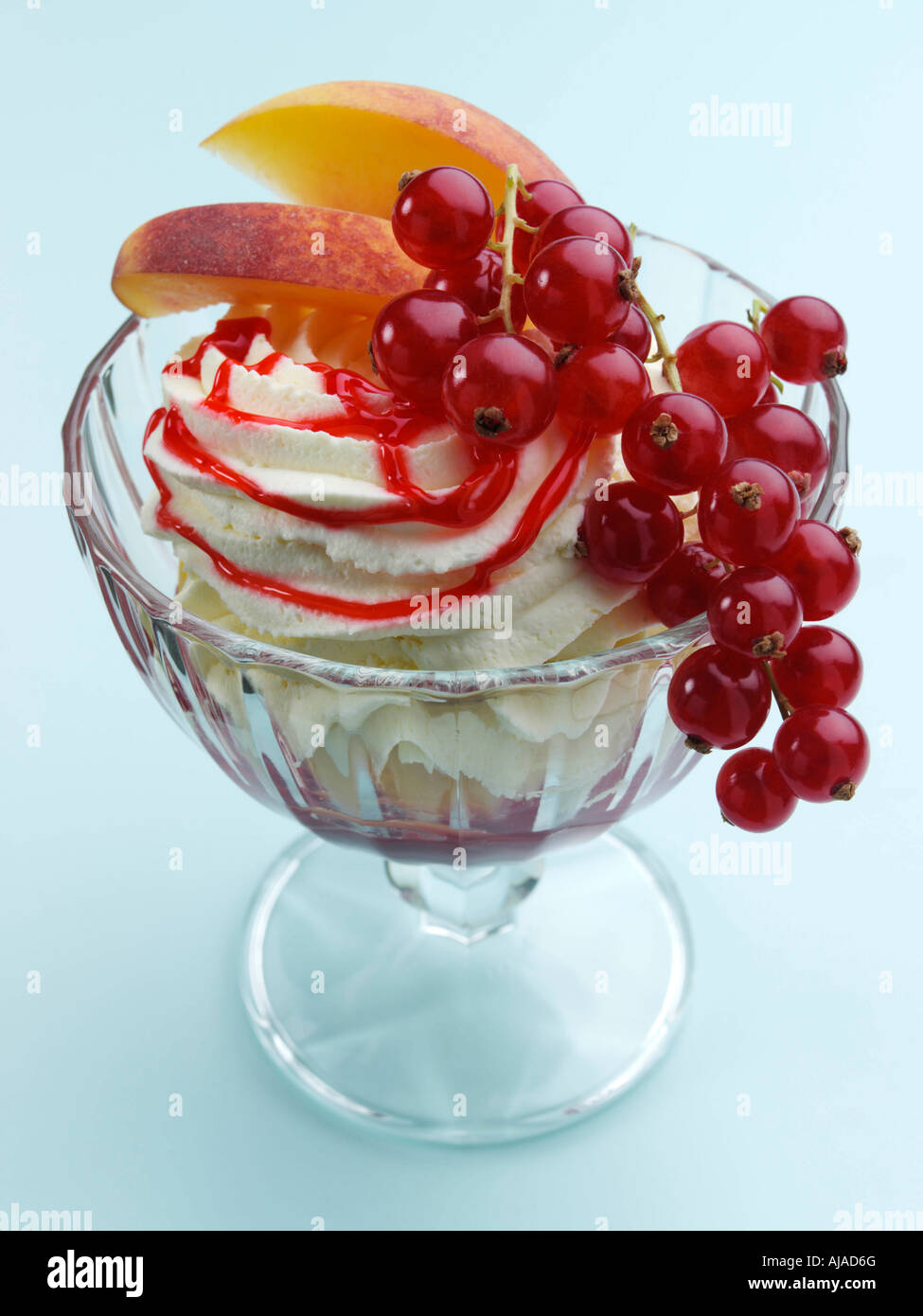 A glass of peach Melba dessert Stock Photo - Alamy