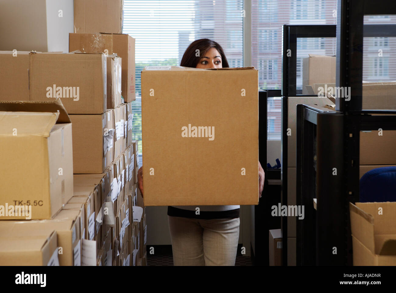 Business woman carrying card boxes, isolated over white background ...
