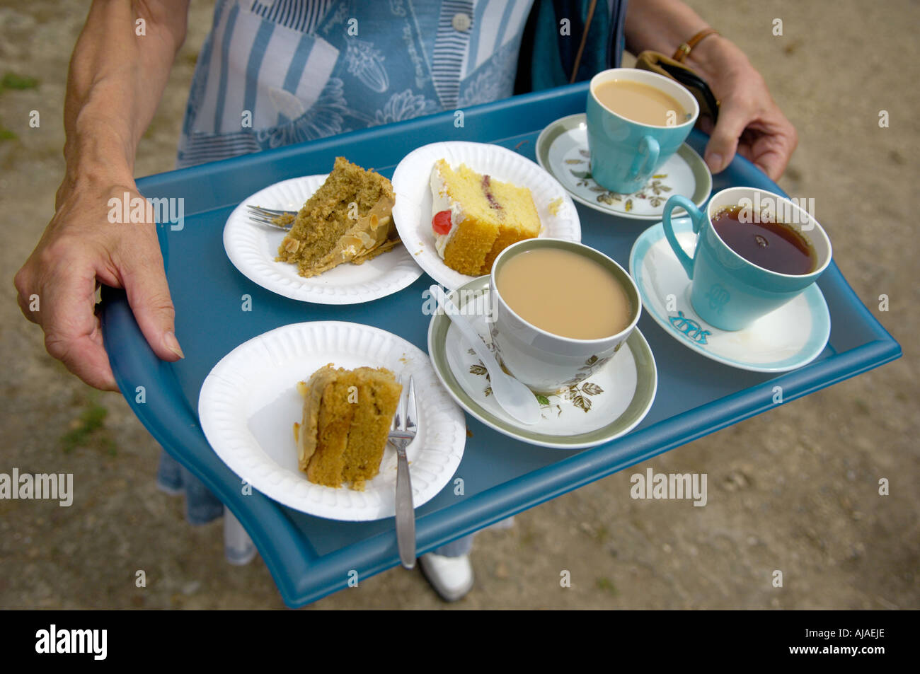 Carrying tea tray hi-res stock photography and images - Alamy