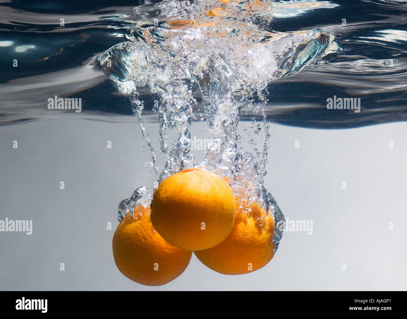 orange falling into water Stock Photo - Alamy