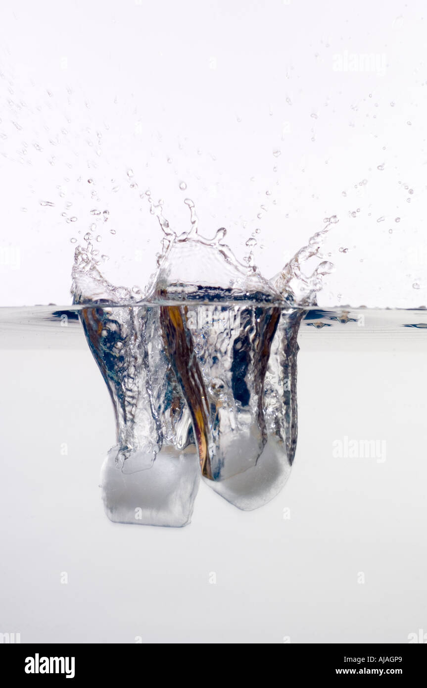 ice cubes falling into water Stock Photo - Alamy
