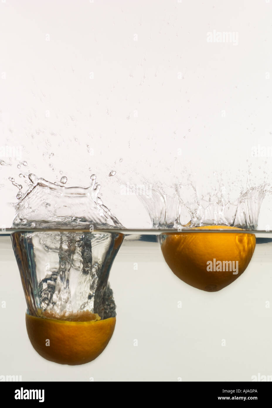 orange falling into water Stock Photo - Alamy
