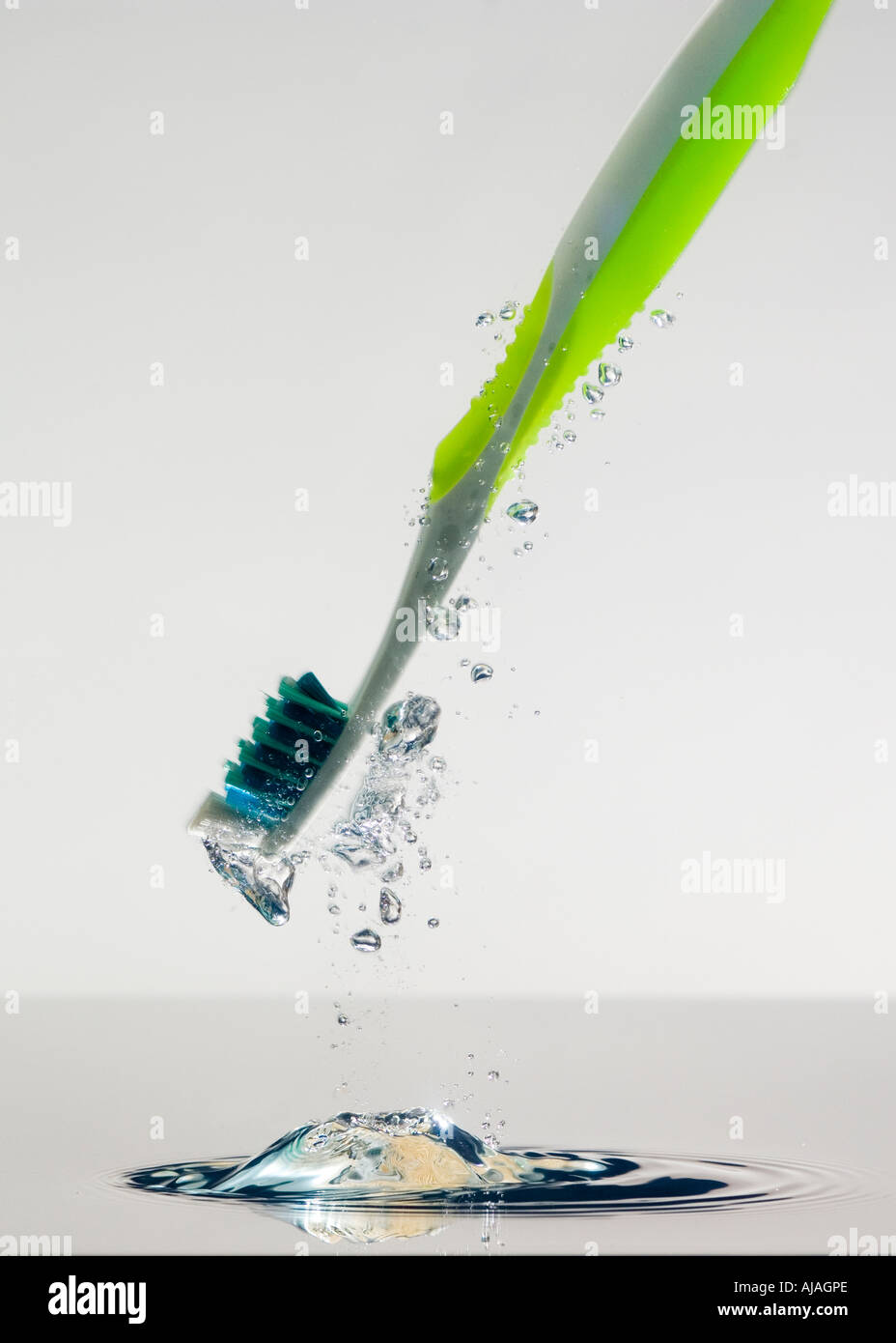 High speed photograph of a tooth brush falling into water Stock Photo ...