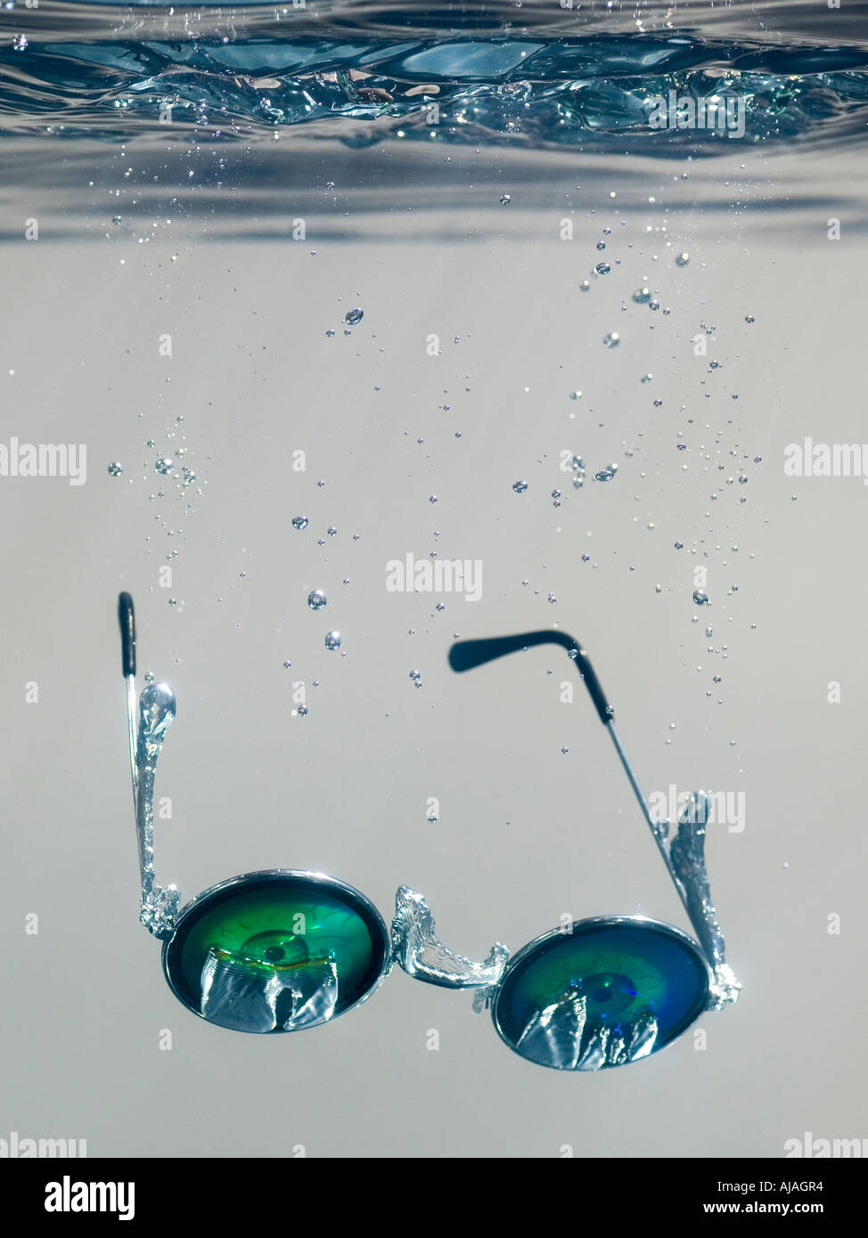 Funny glasses falling into water Stock Photo - Alamy
