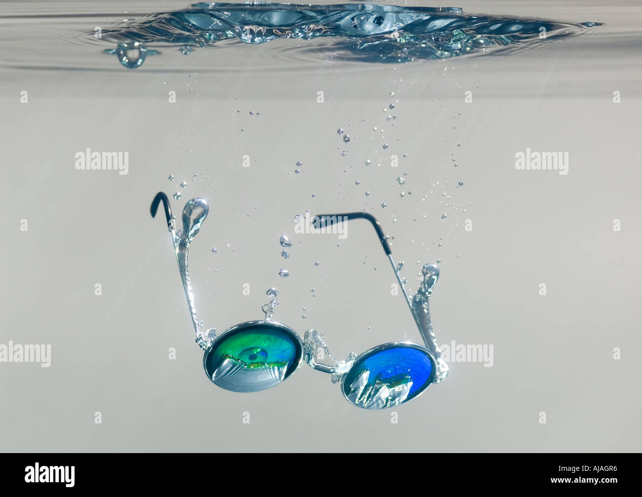 Funny glasses falling into water Stock Photo - Alamy
