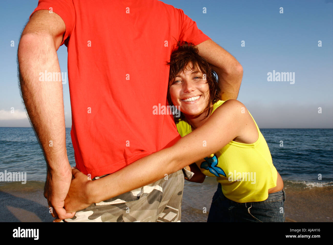 Woman smiling and Affection and embracing friends Stock Photo - Alamy