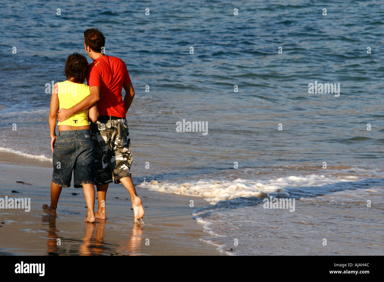 colorful couple at the beach Stock Photo - Alamy