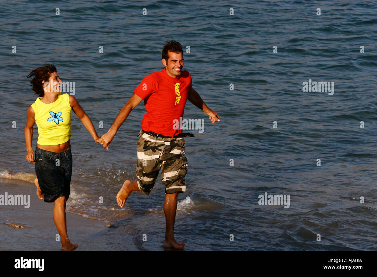 colorful couple at the beach Stock Photo - Alamy