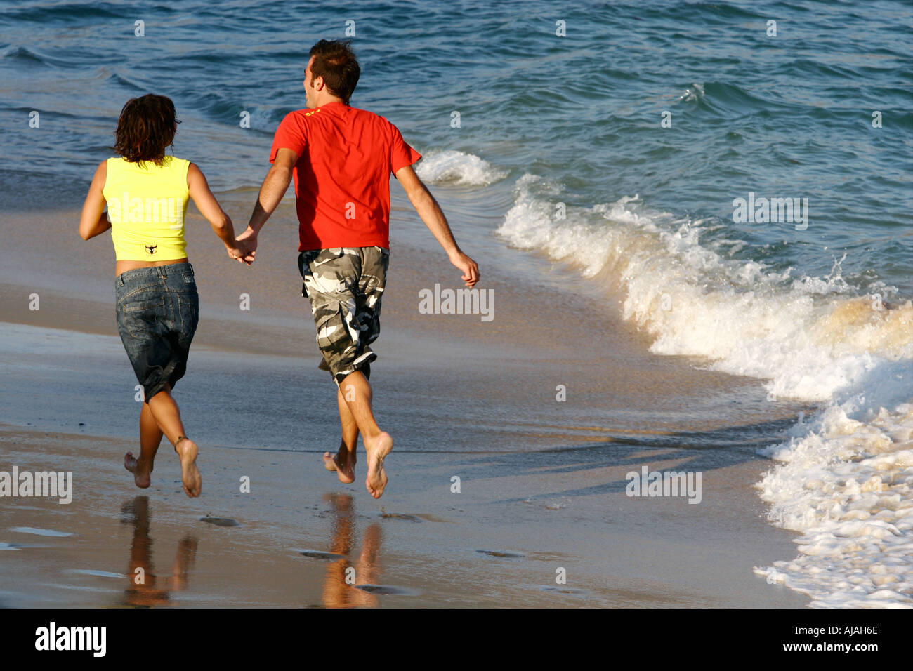 colorful couple at the beach Stock Photo - Alamy